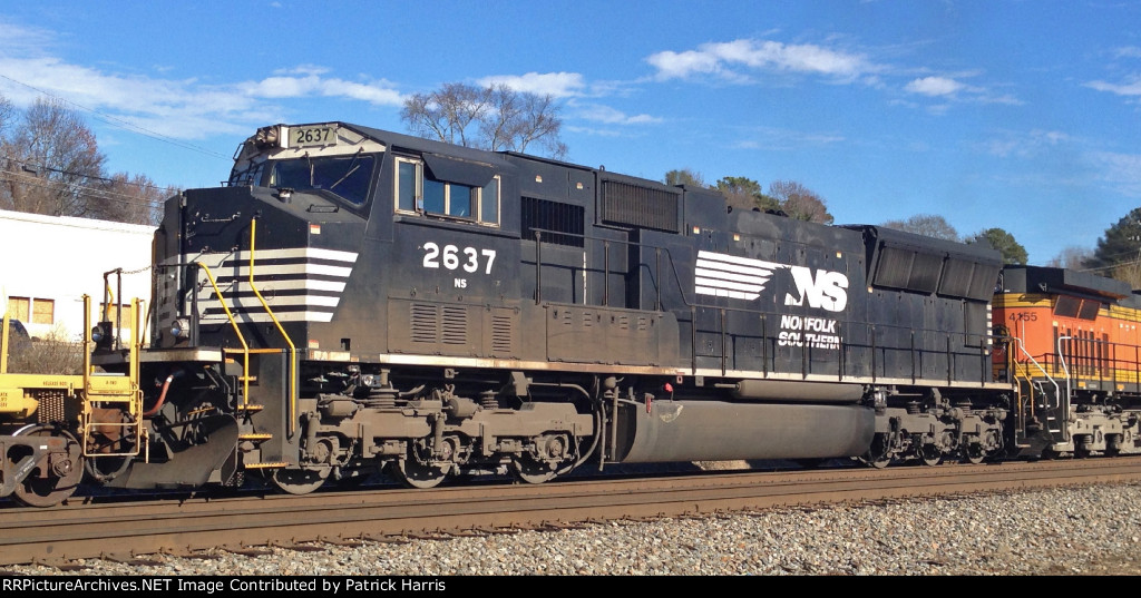 NS 2637 SD70M helps BNSF 4155 C44-9W hustle an intermodel train east at Church Street in ...